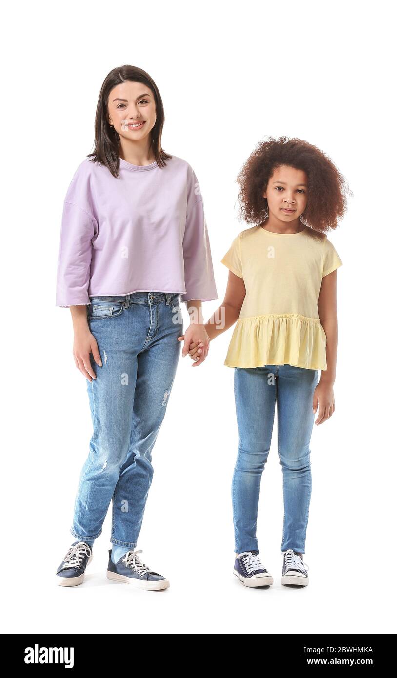 Happy woman with little adopted girl on white background Stock Photo ...