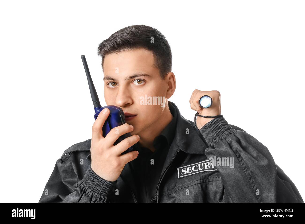 Male security guard with flashlight on white background Stock Photo - Alamy
