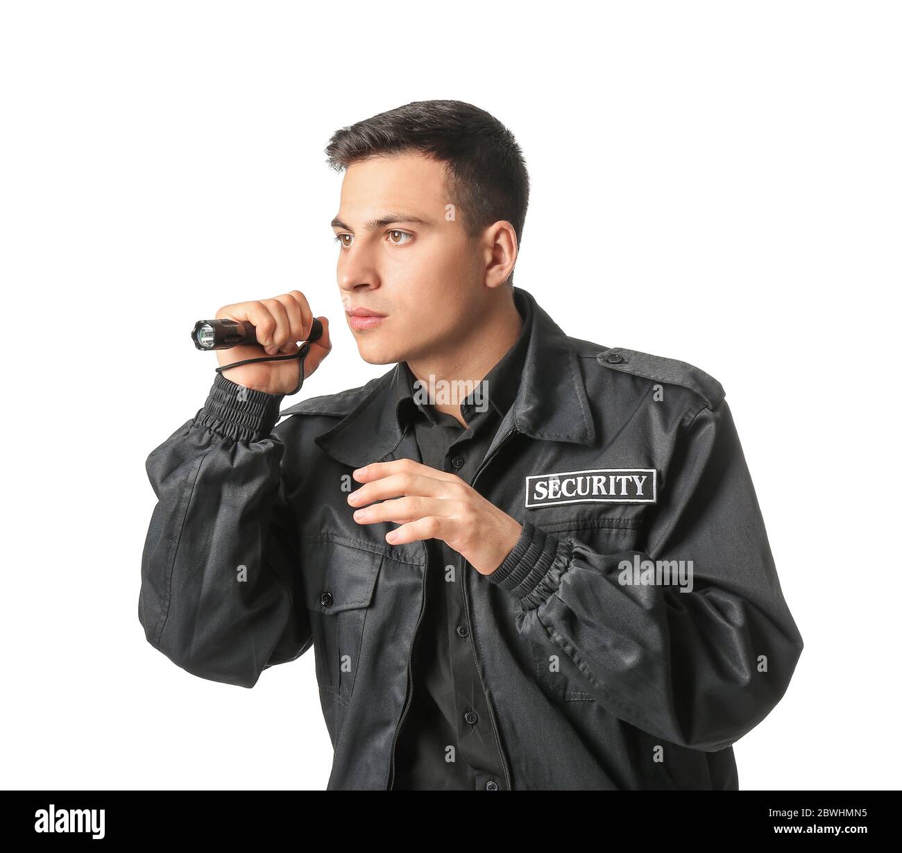 Male security guard with flashlight on white background Stock Photo - Alamy