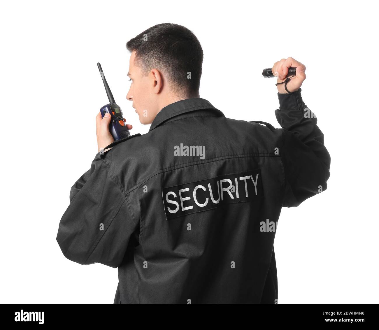 Male security guard with flashlight on white background Stock Photo - Alamy