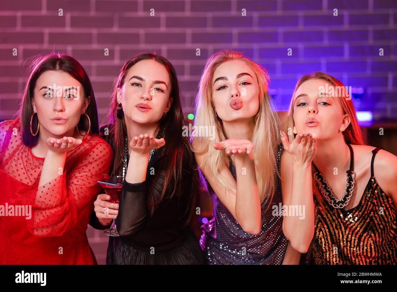 Beautiful young women in night club Stock Photo - Alamy