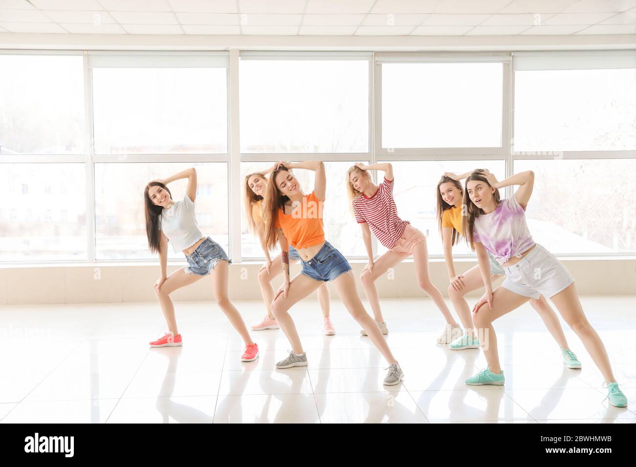 Beautiful young women dancing in studio Stock Photo - Alamy