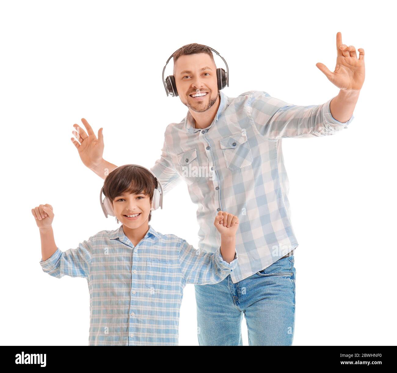 Father and little son listening to music on white background Stock ...
