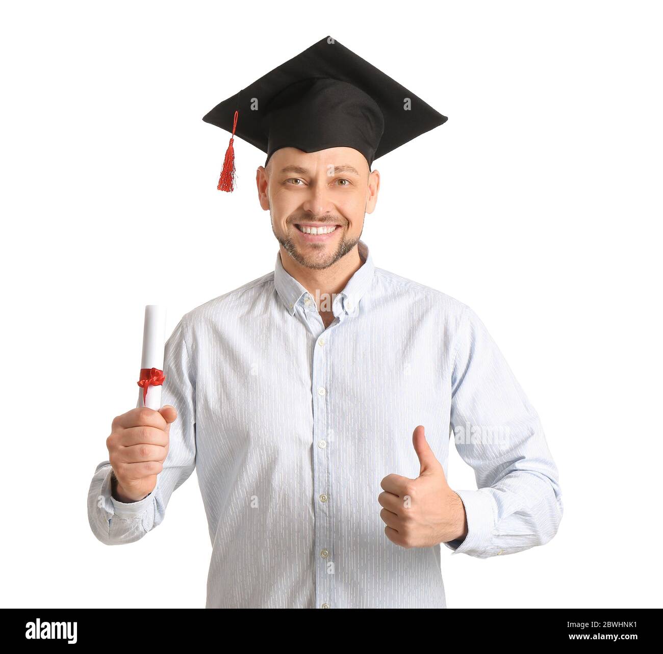 Man in graduation hat and with diploma on white background Stock Photo ...