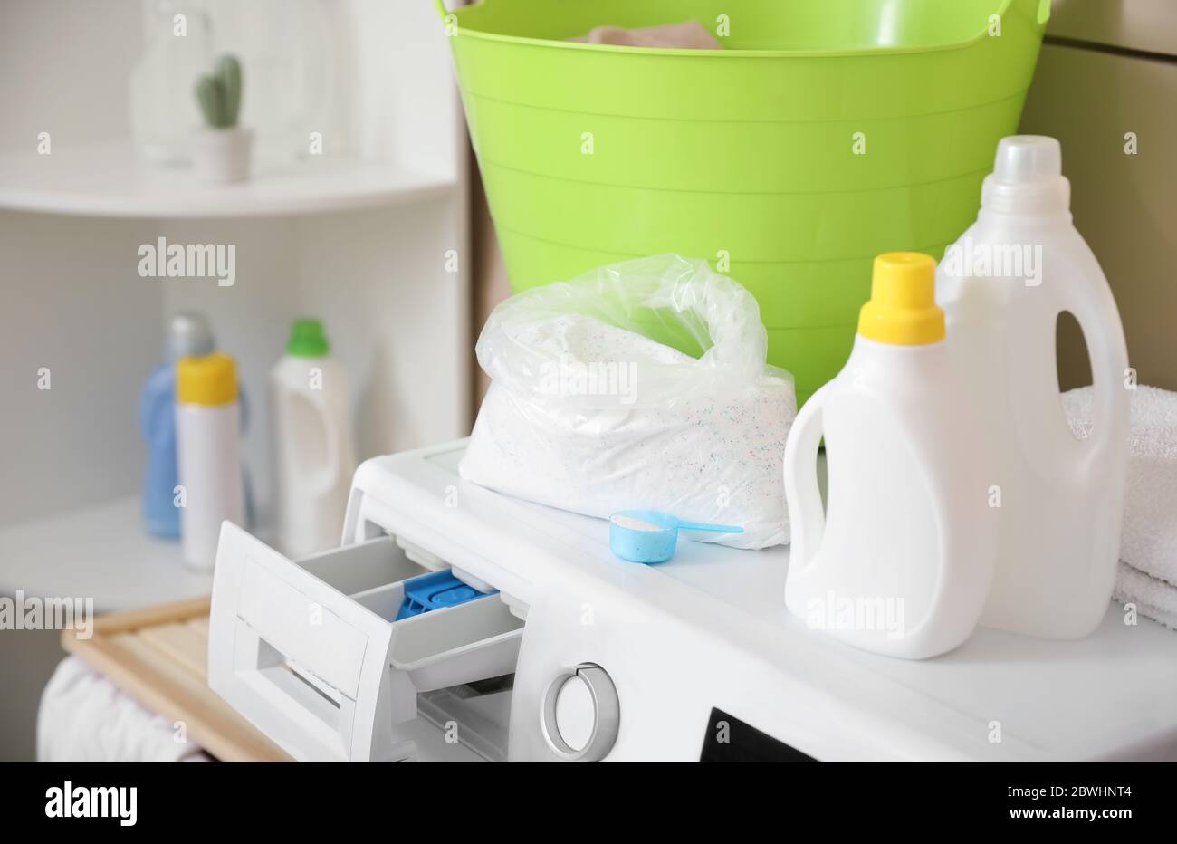 Different detergents on washing machine Stock Photo - Alamy