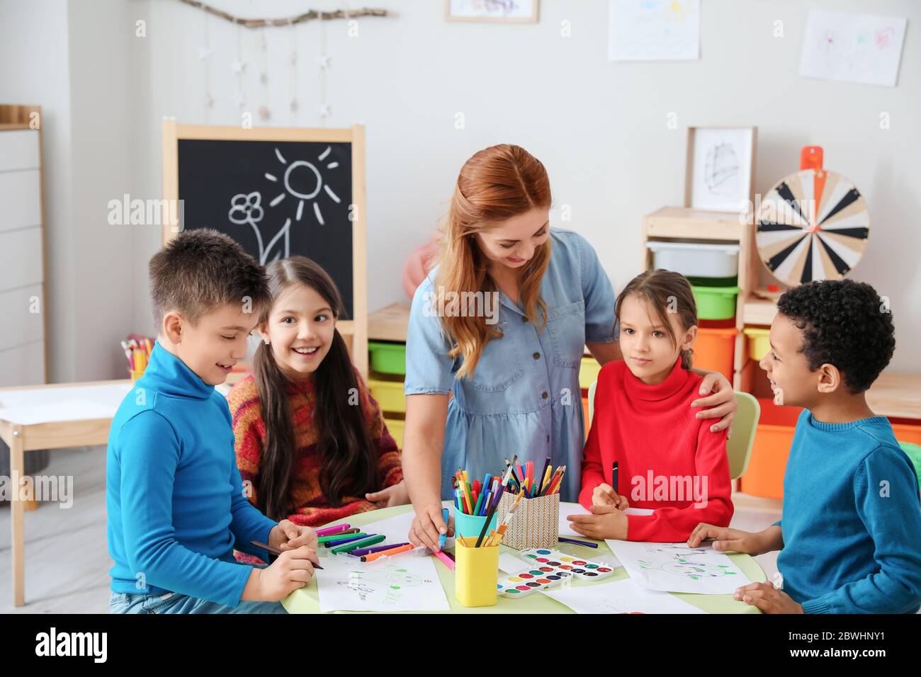Drawing teacher giving classes at school Stock Photo - Alamy