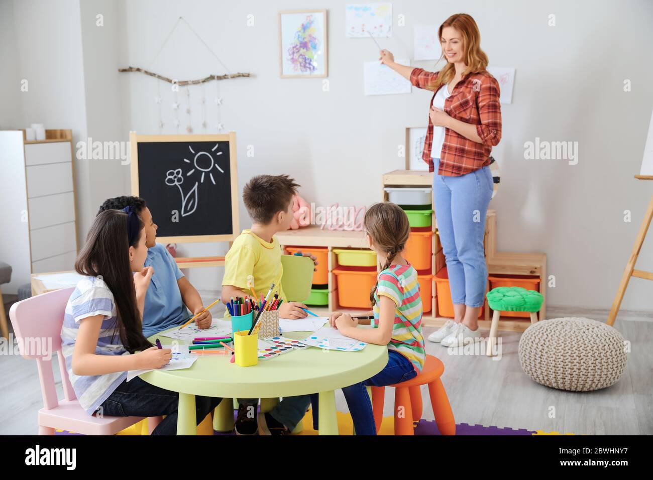 Drawing teacher giving classes at school Stock Photo - Alamy