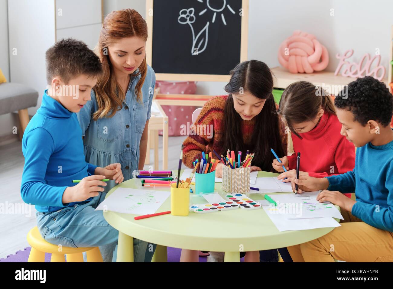Drawing teacher giving classes at school Stock Photo - Alamy