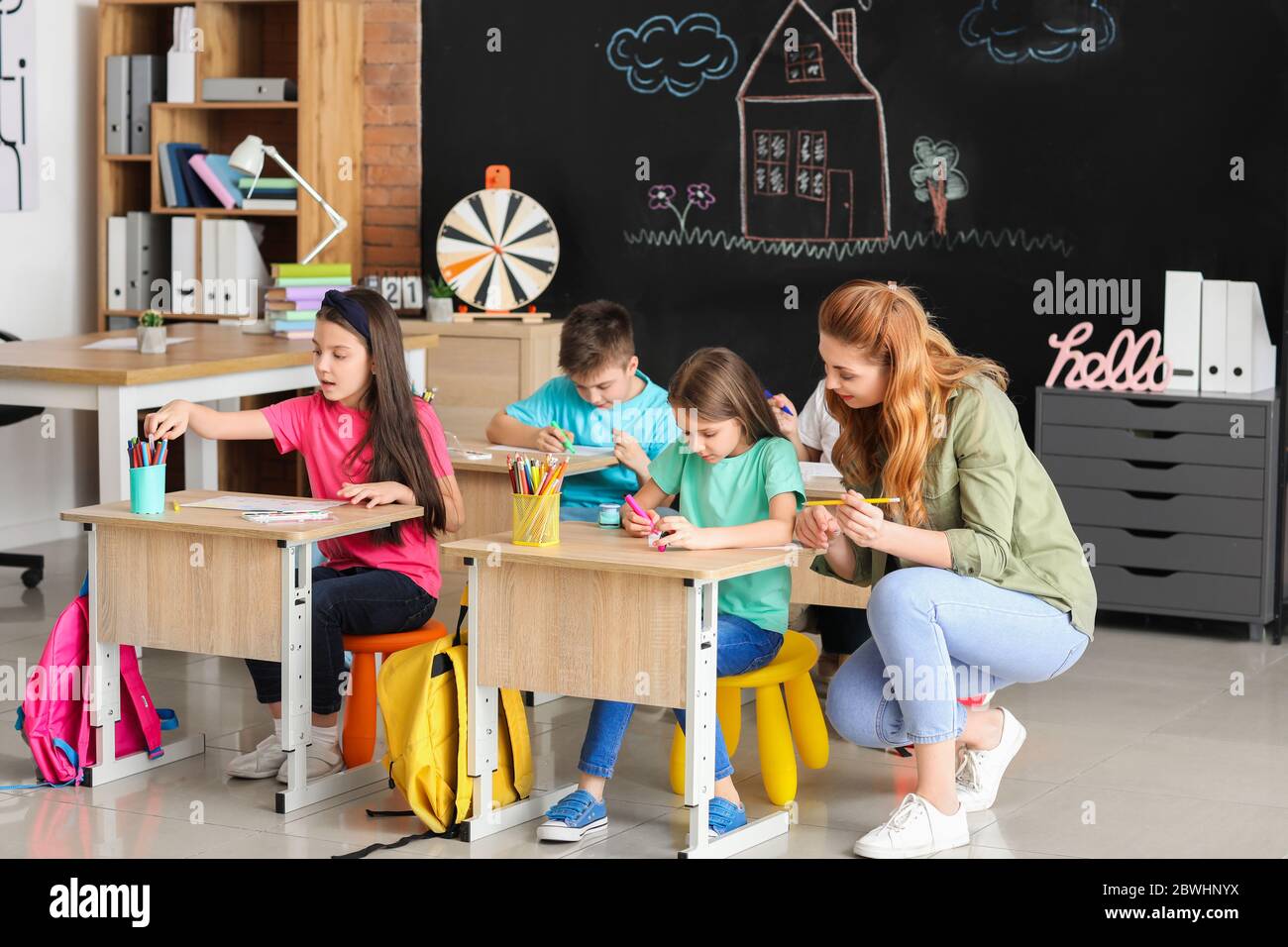 Drawing teacher giving classes at school Stock Photo - Alamy