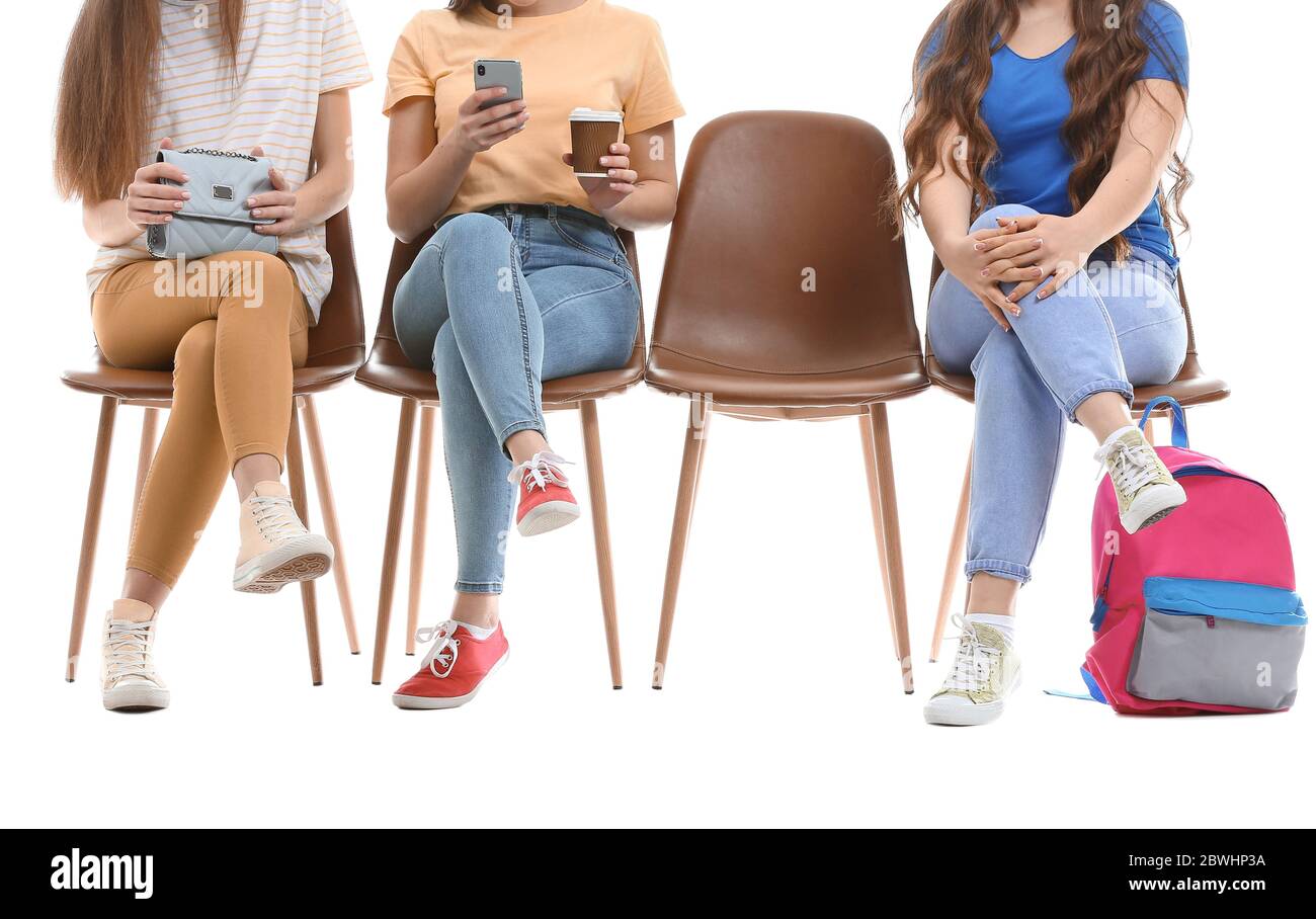 Students waiting in line on white background Stock Photo - Alamy