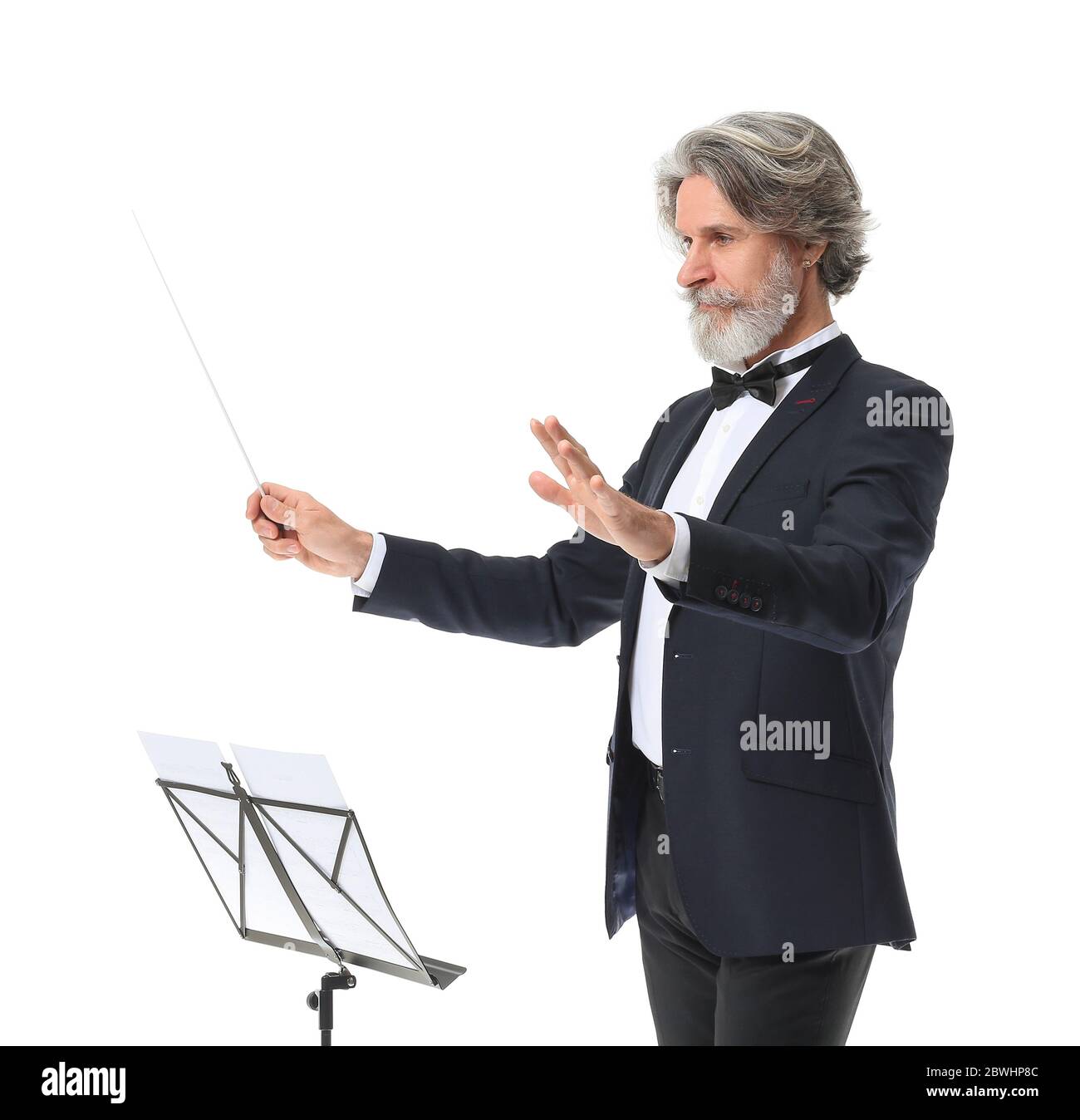 Senior male conductor on white background Stock Photo - Alamy