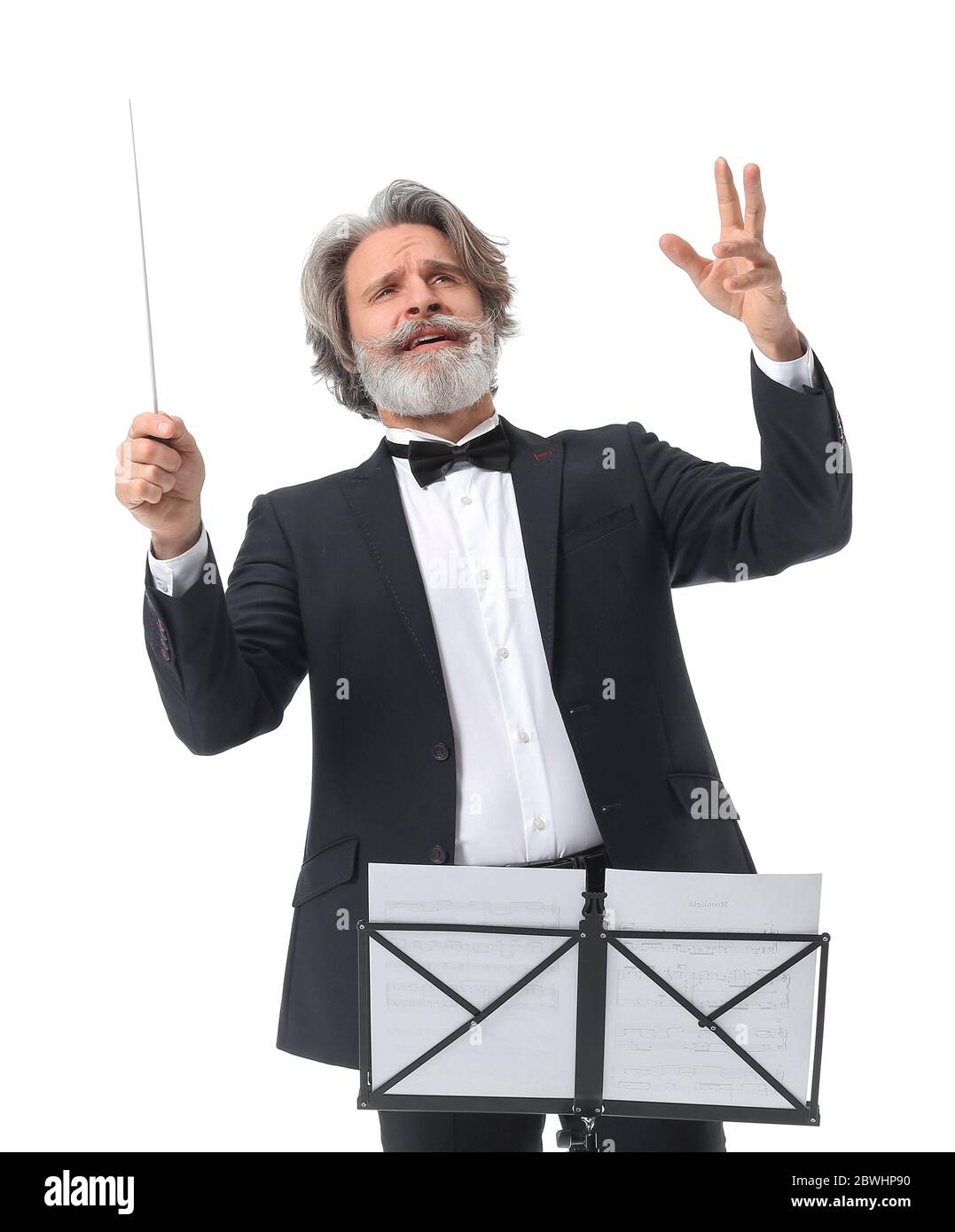 Senior male conductor on white background Stock Photo - Alamy