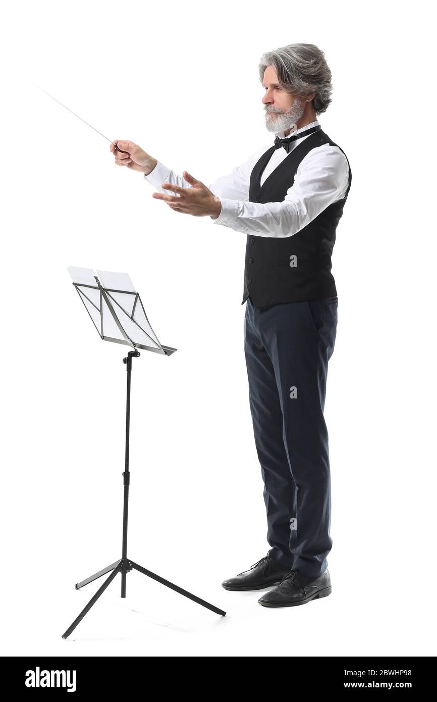 Senior male conductor on white background Stock Photo - Alamy