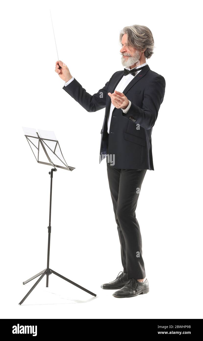 Senior male conductor on white background Stock Photo - Alamy