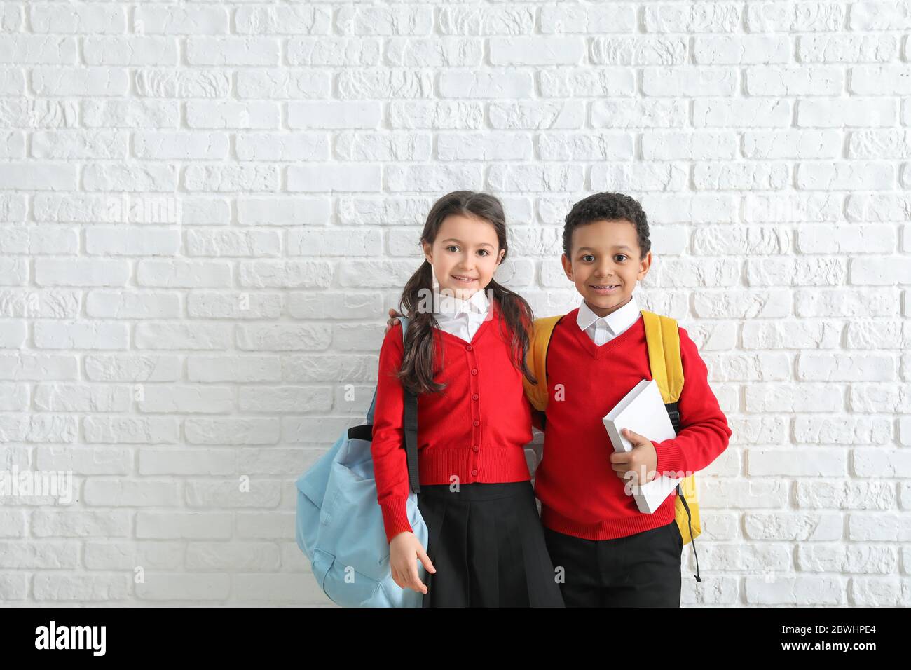 Cute little pupils on white background Stock Photo - Alamy