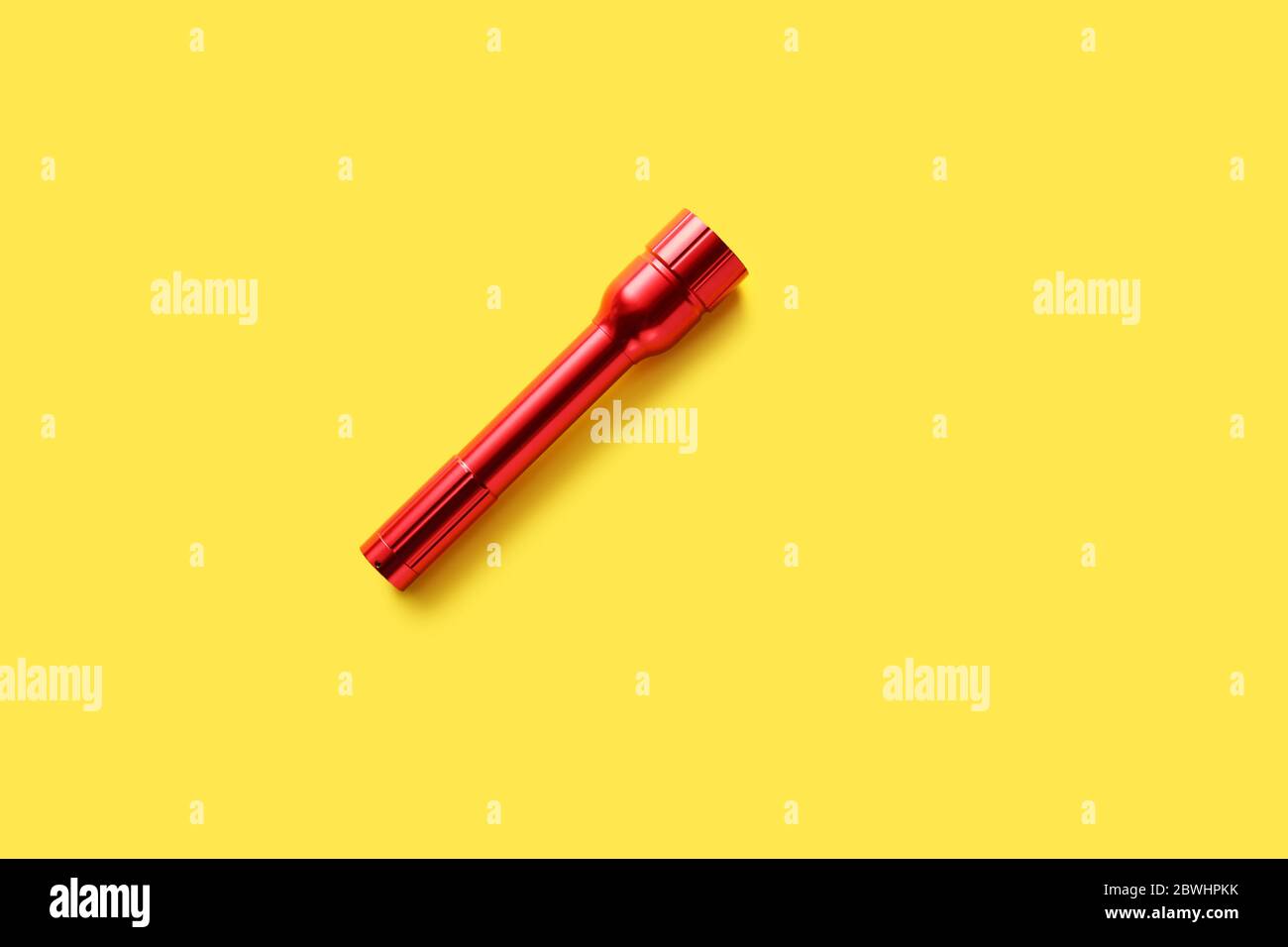 Modern flashlight on color background Stock Photo - Alamy