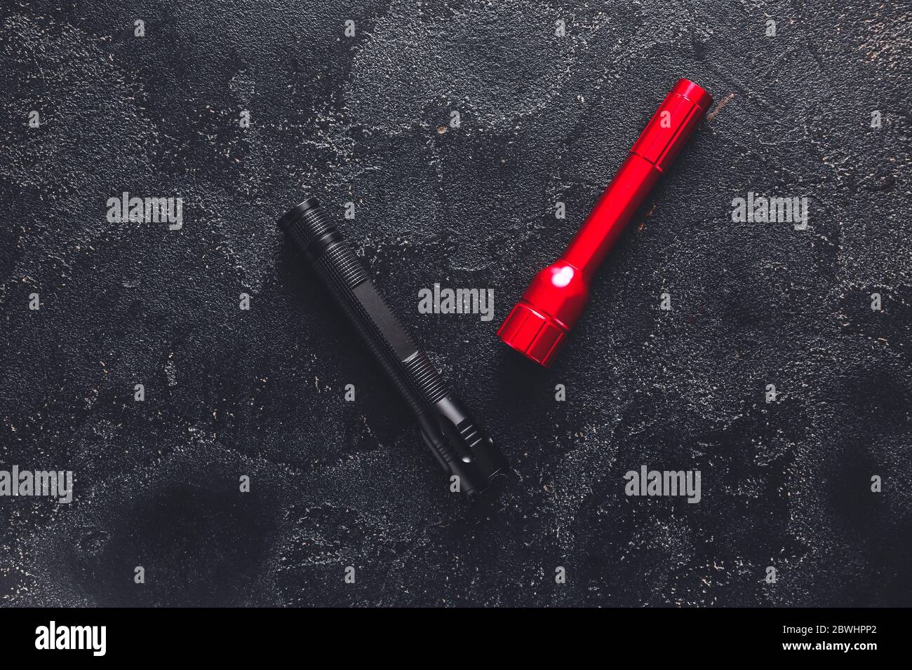 Modern flashlights on dark background Stock Photo - Alamy