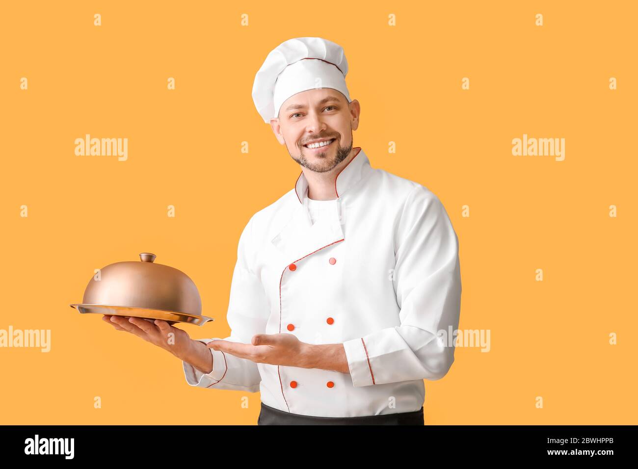 Portrait of male chef on color background Stock Photo - Alamy