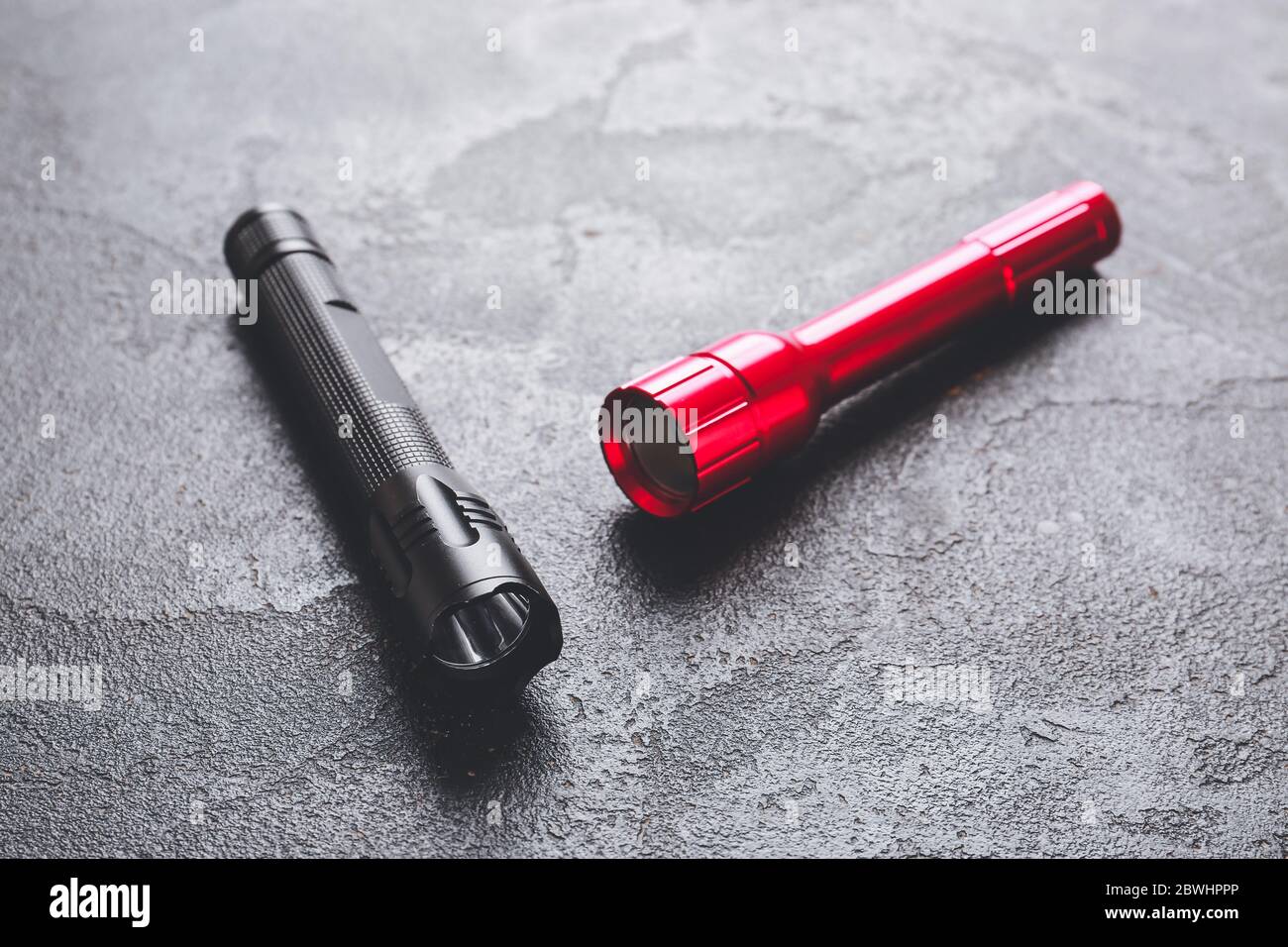 Modern flashlights on dark background Stock Photo - Alamy