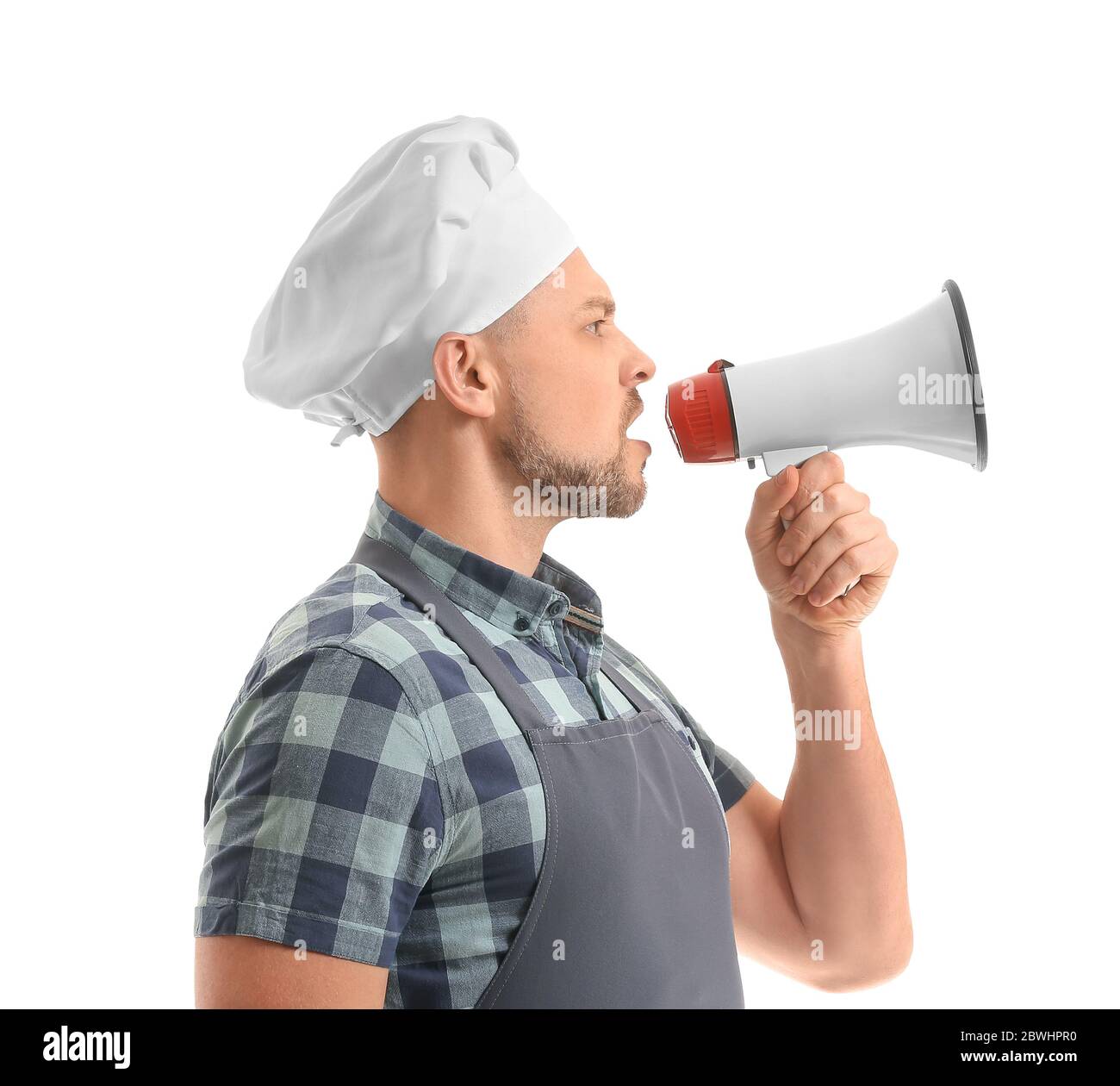 Portrait of male chef with megaphone on white background Stock Photo ...