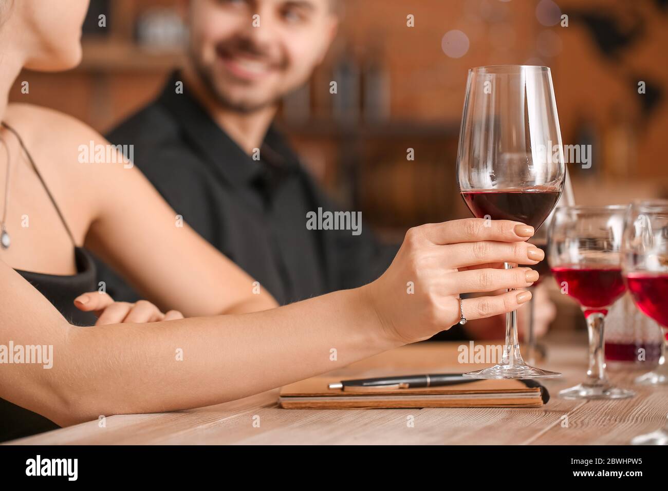 People tasting wine at the restaurant Stock Photo - Alamy