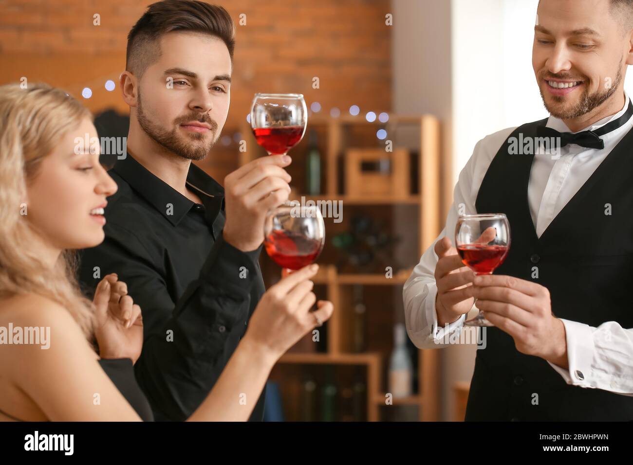 People tasting wine at the restaurant Stock Photo - Alamy