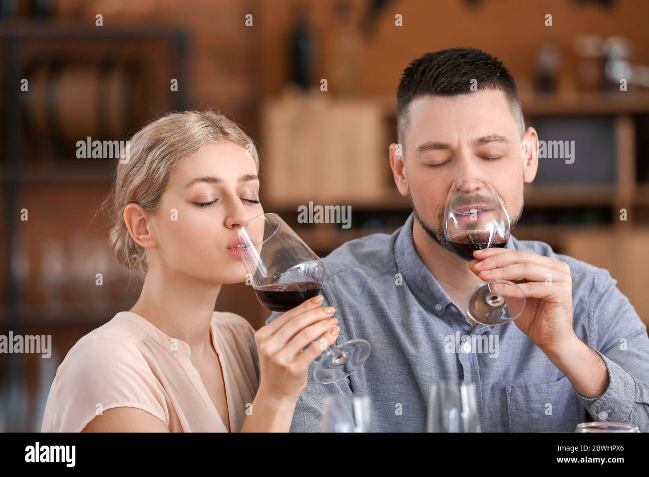People tasting wine at the restaurant Stock Photo - Alamy