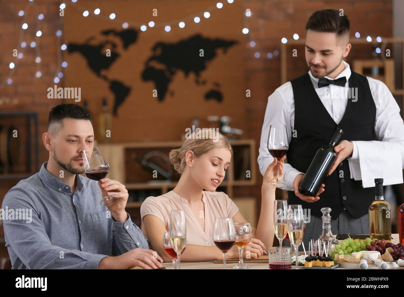 People tasting wine at the restaurant Stock Photo - Alamy