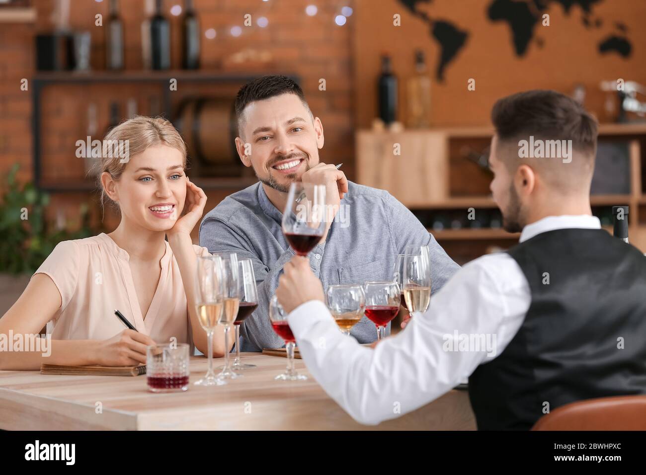 People tasting wine at the restaurant Stock Photo - Alamy