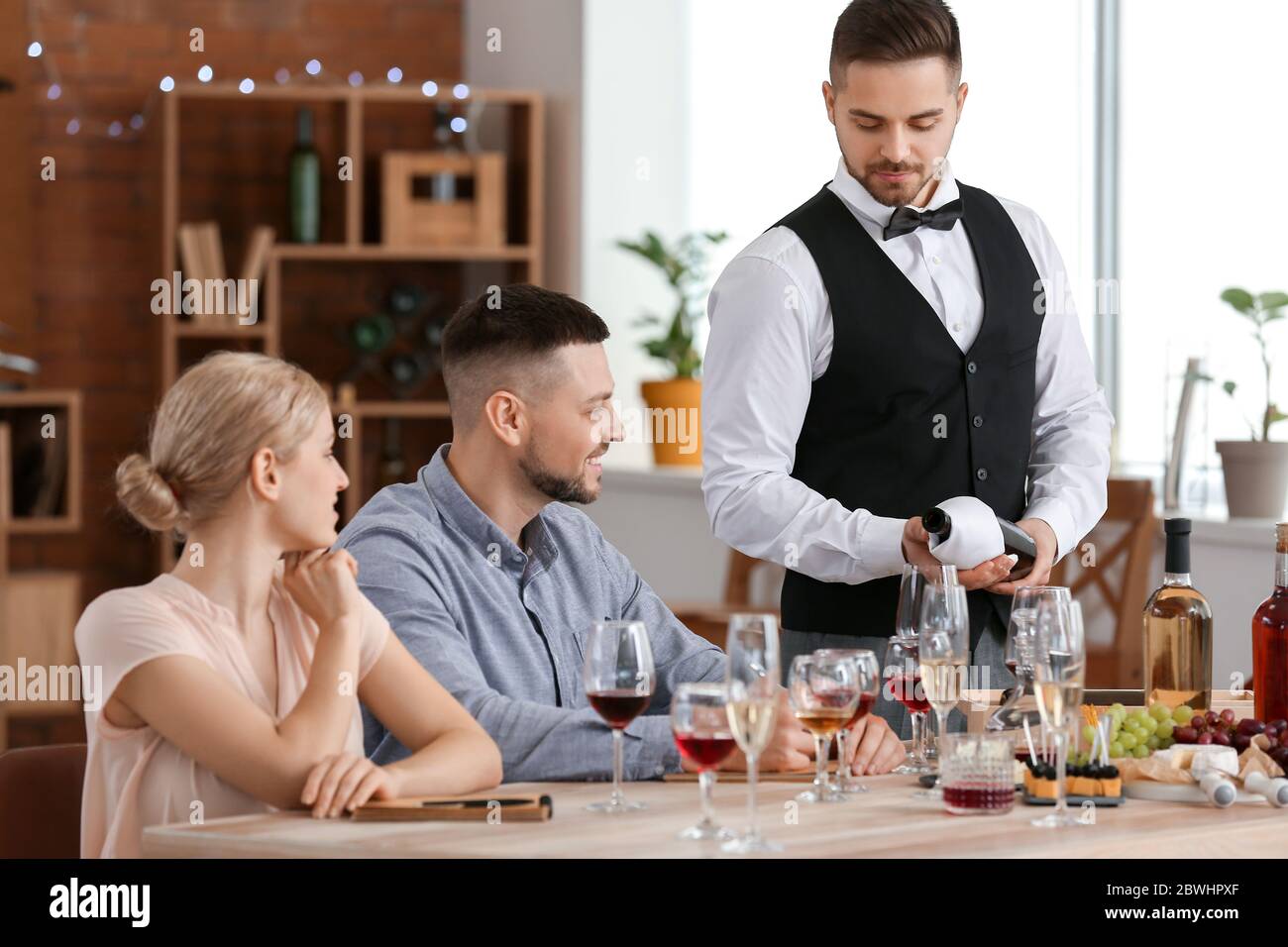 People tasting wine at the restaurant Stock Photo - Alamy