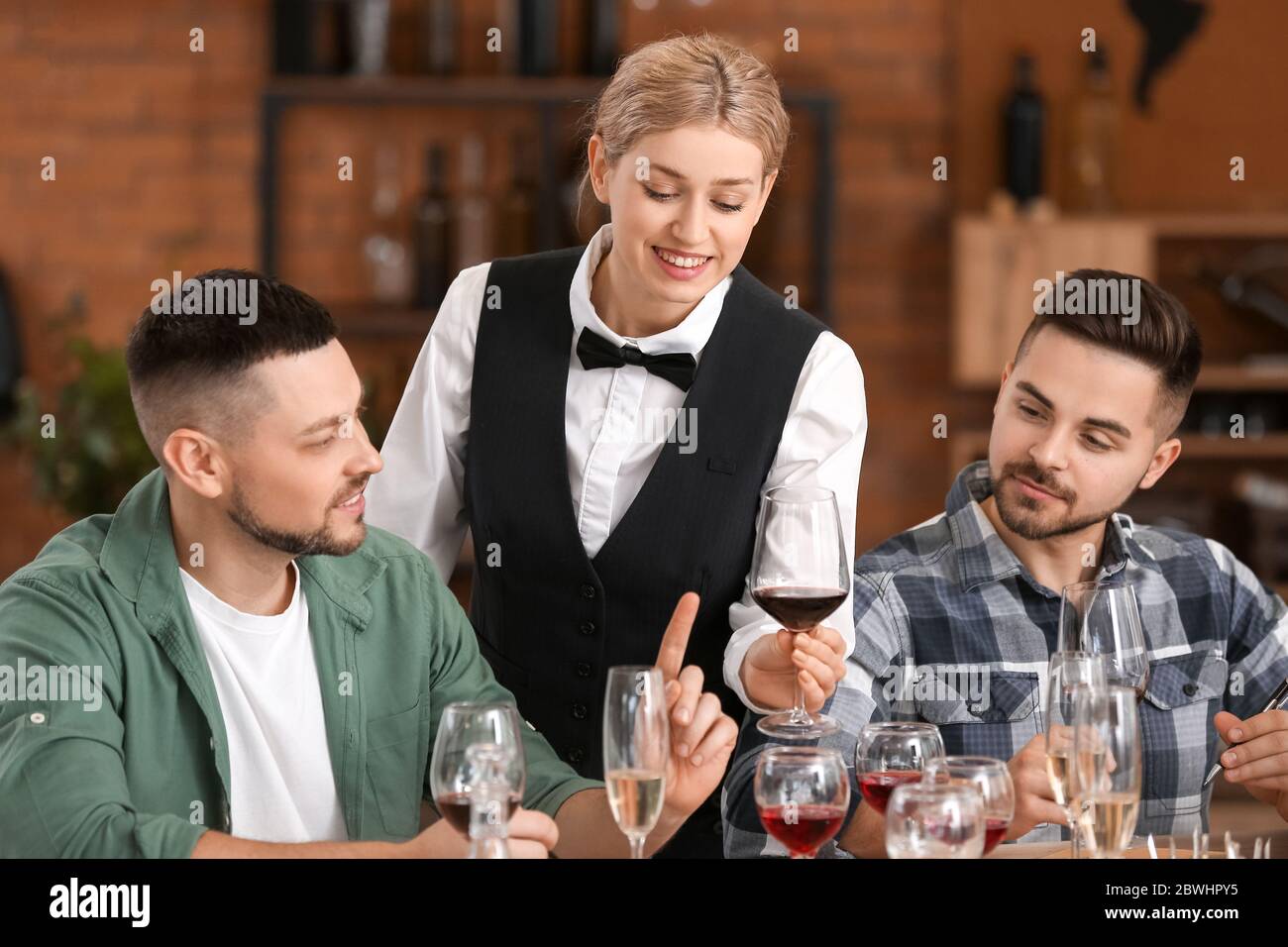 People tasting wine at the restaurant Stock Photo - Alamy