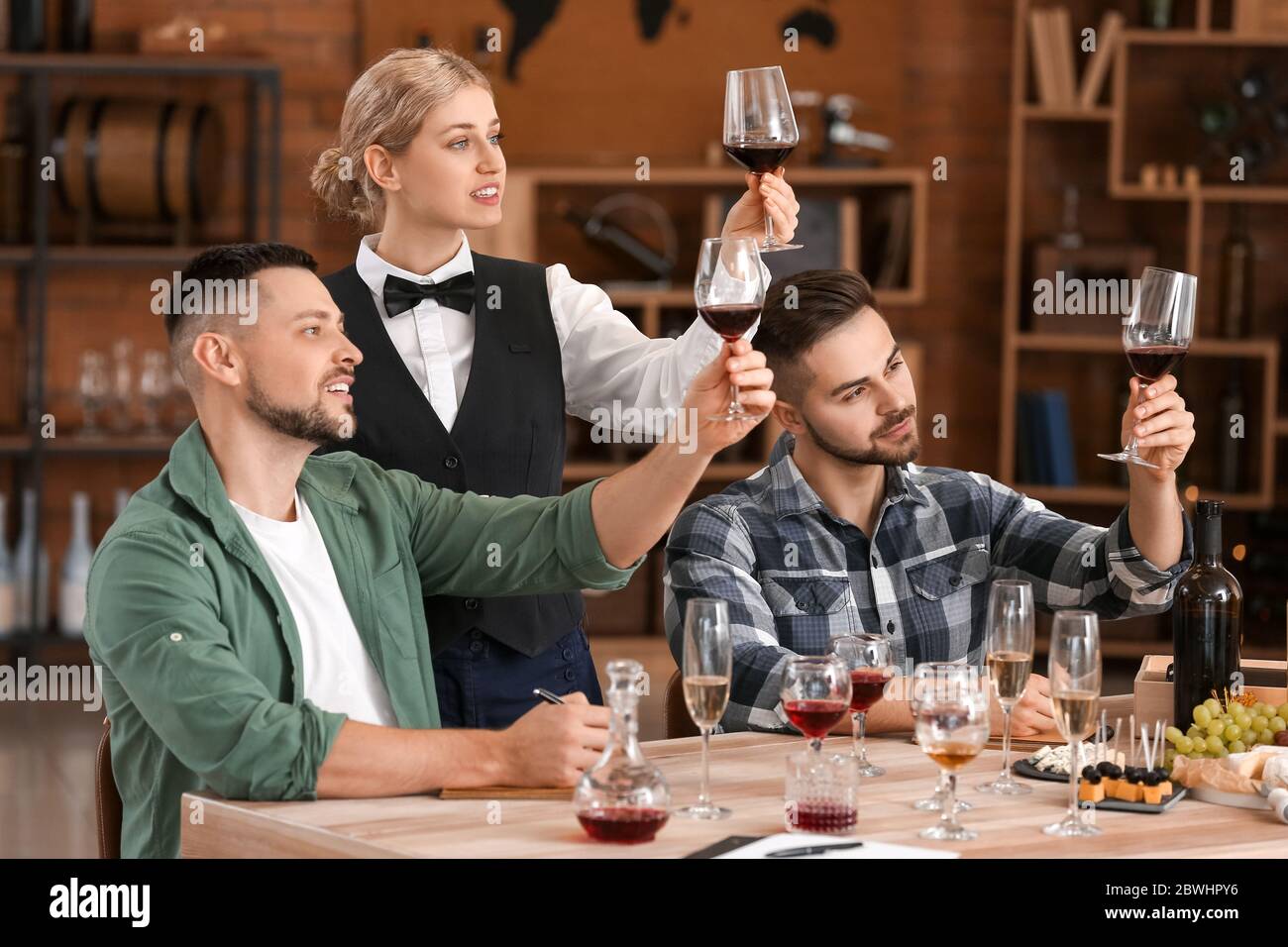 People tasting wine at the restaurant Stock Photo - Alamy
