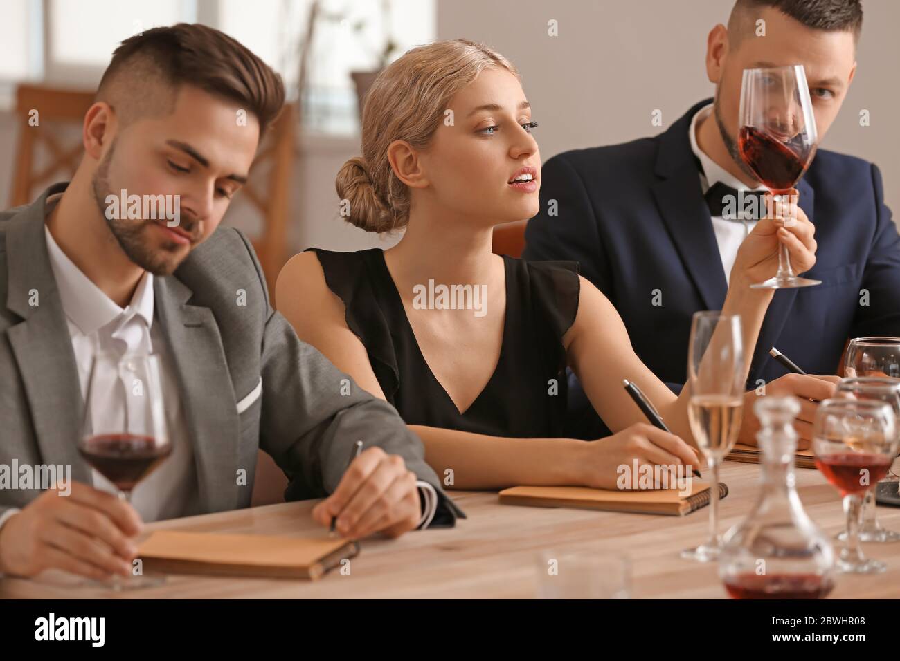 People tasting wine at the restaurant Stock Photo - Alamy
