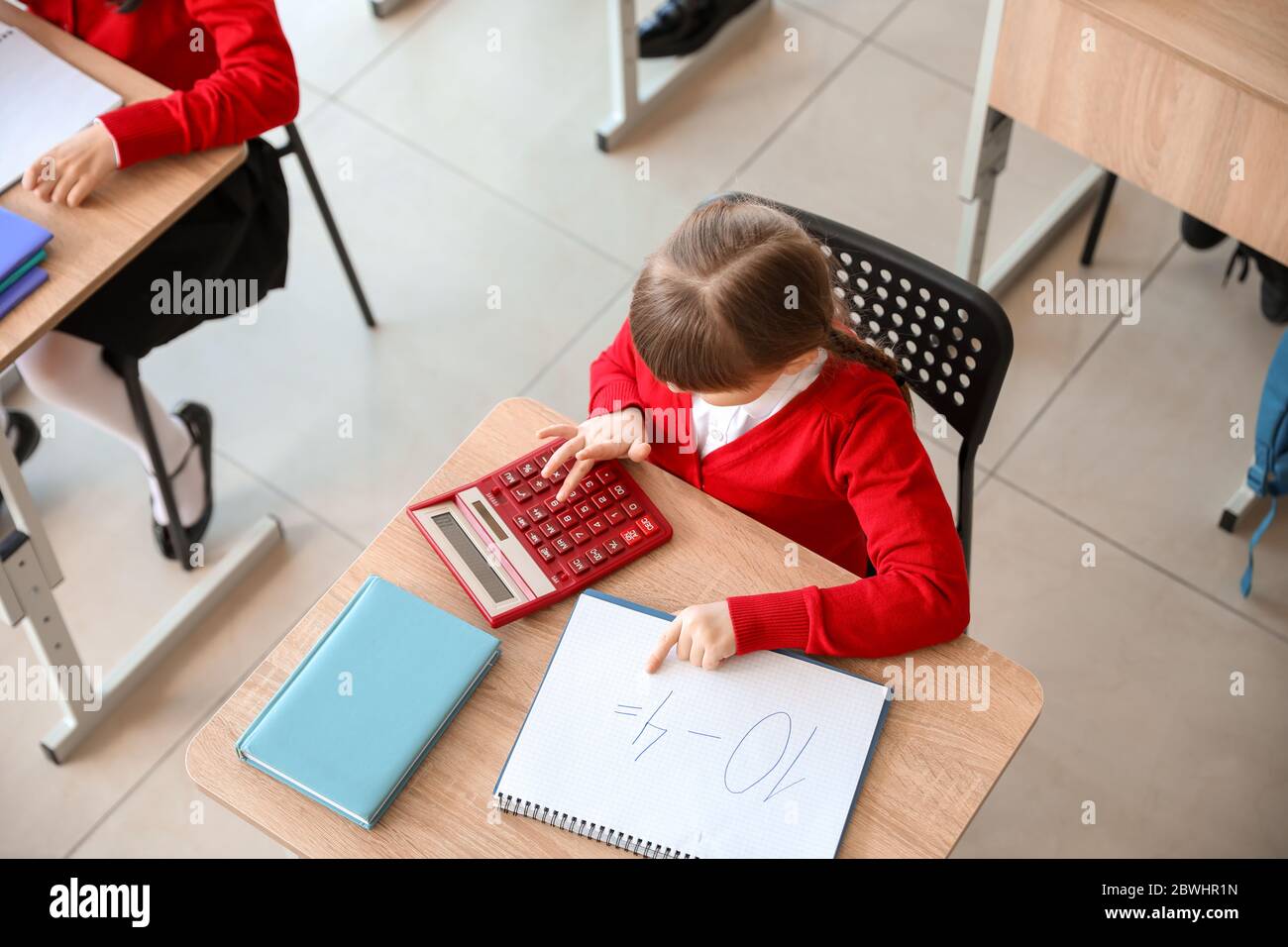Girl school desk classroom calculator hi-res stock photography and ...