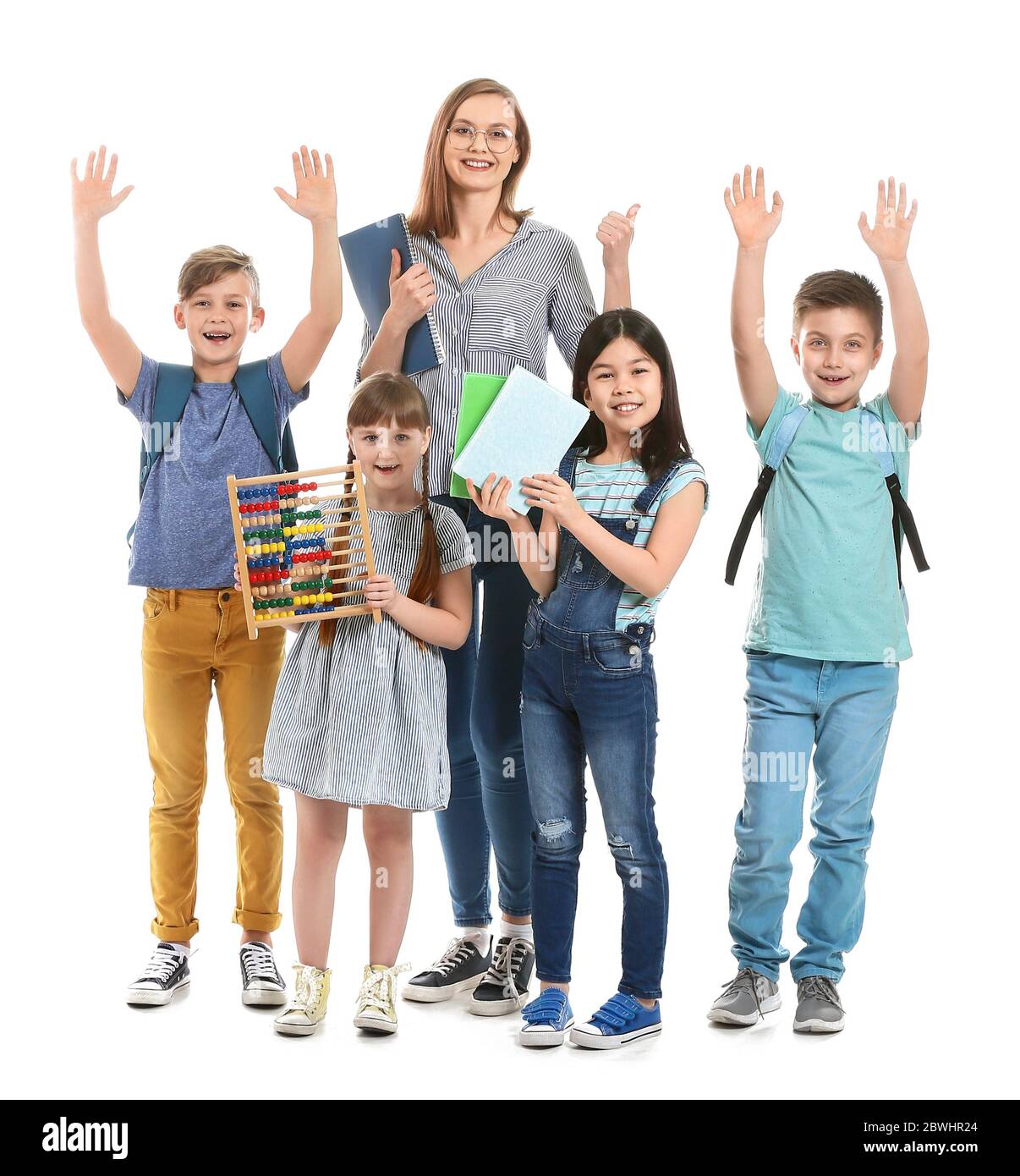 Happy little pupils with math teacher on white background Stock Photo ...
