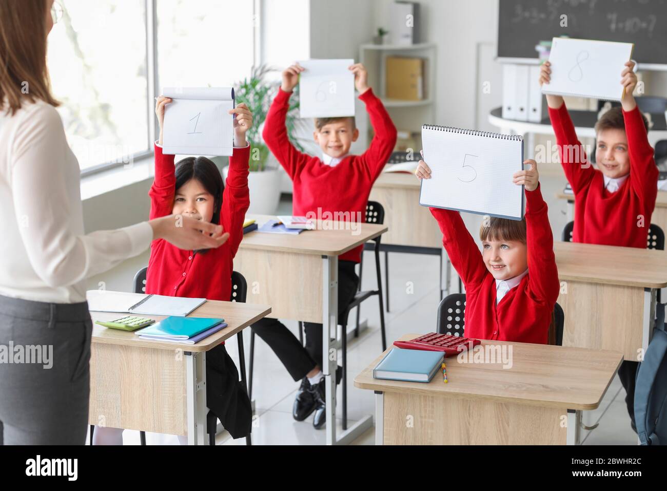 Children during math lesson in classroom Stock Photo - Alamy