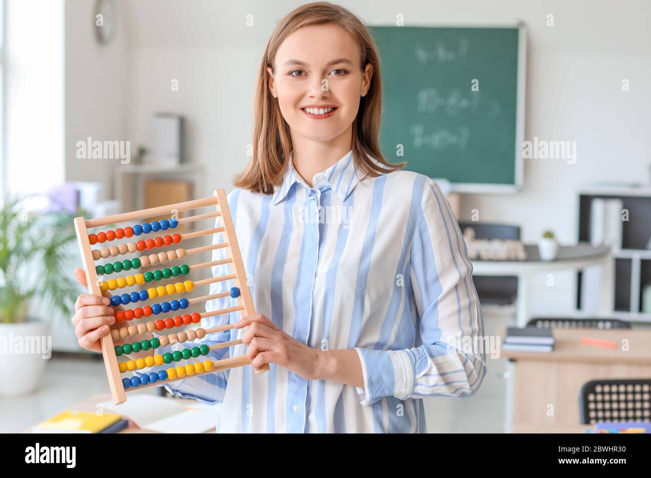 Beautiful math teacher in classroom Stock Photo - Alamy