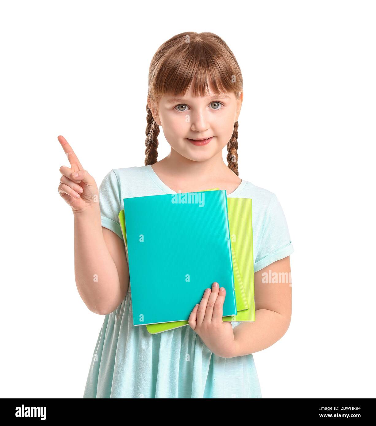 Little pupil with raised index finger on white background Stock Photo ...