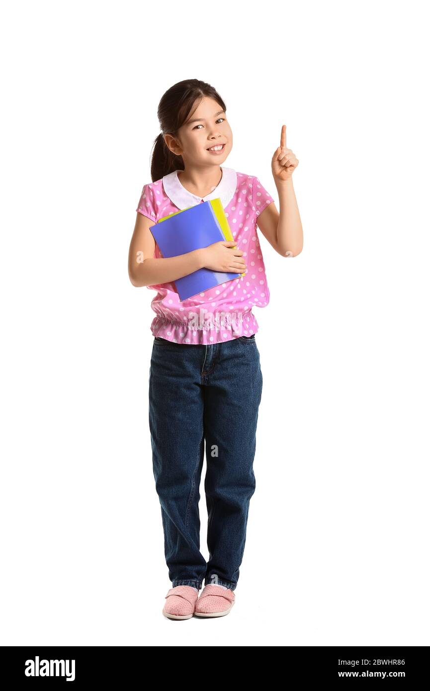 Little pupil with raised index finger on white background Stock Photo ...
