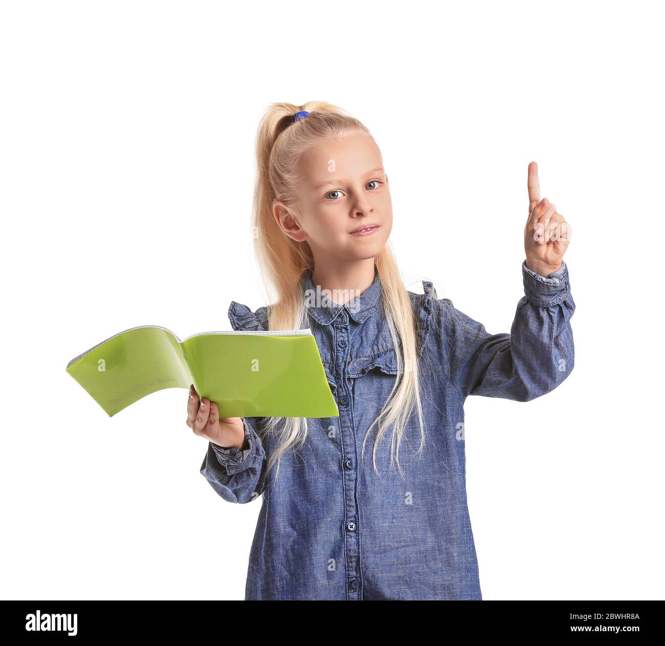 Little pupil with raised index finger on white background Stock Photo ...