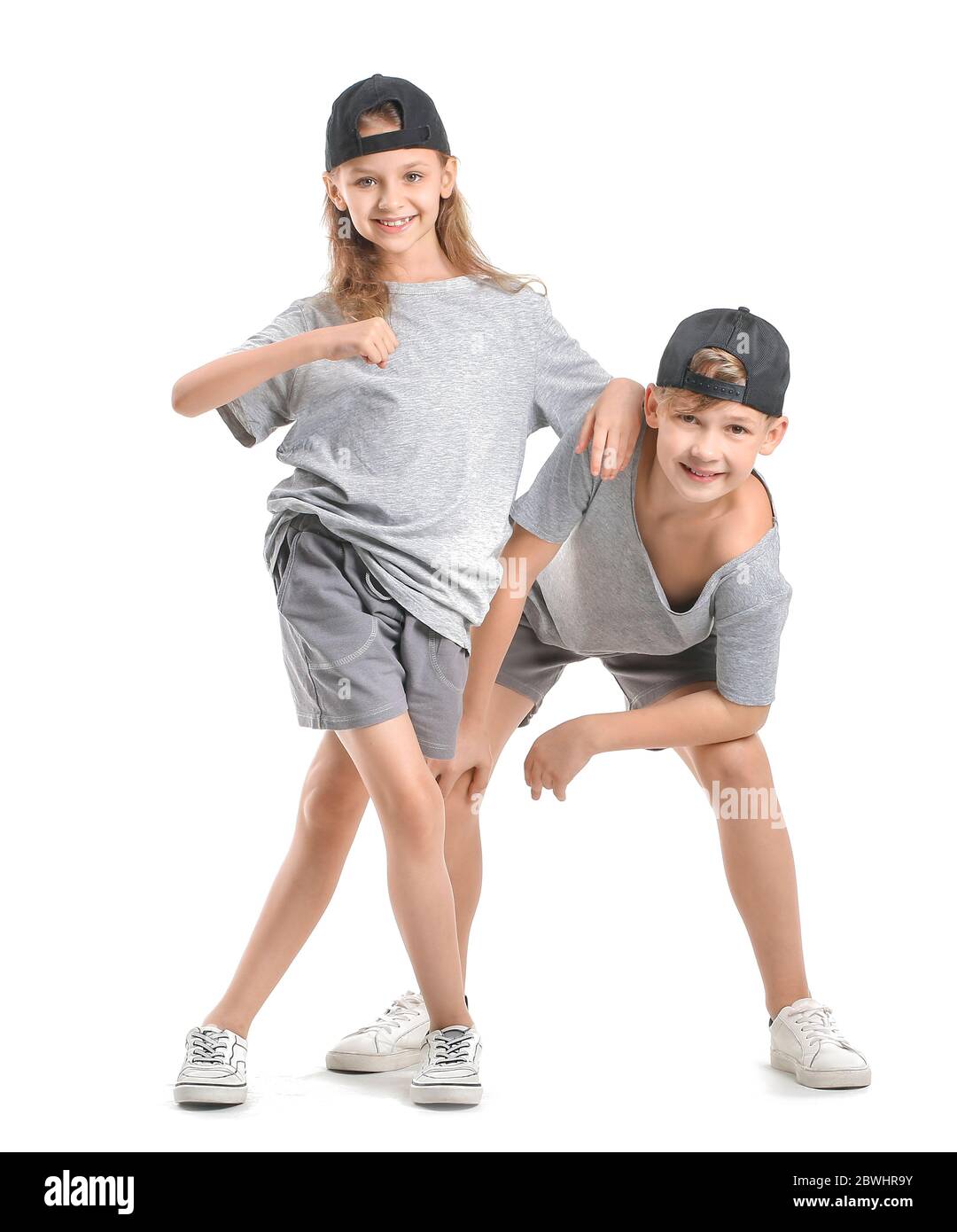 Cute little children dancing against white background Stock Photo - Alamy