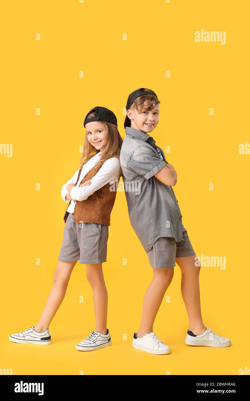 Cute little children dancing against color background Stock Photo - Alamy
