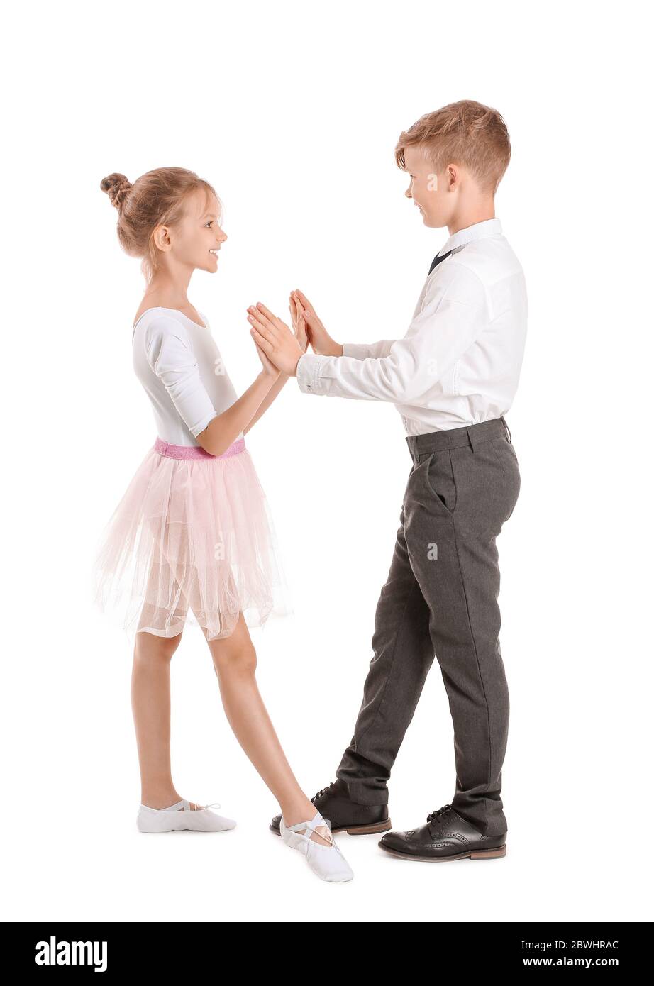 Cute little children dancing against white background Stock Photo - Alamy