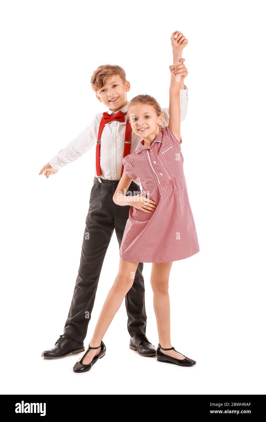 Cute little children dancing against white background Stock Photo - Alamy