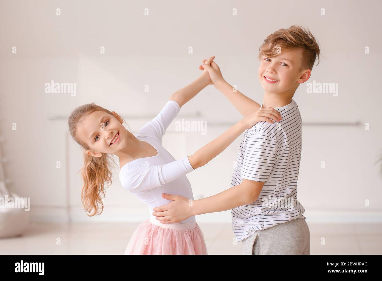 Cute little children dancing in studio Stock Photo - Alamy