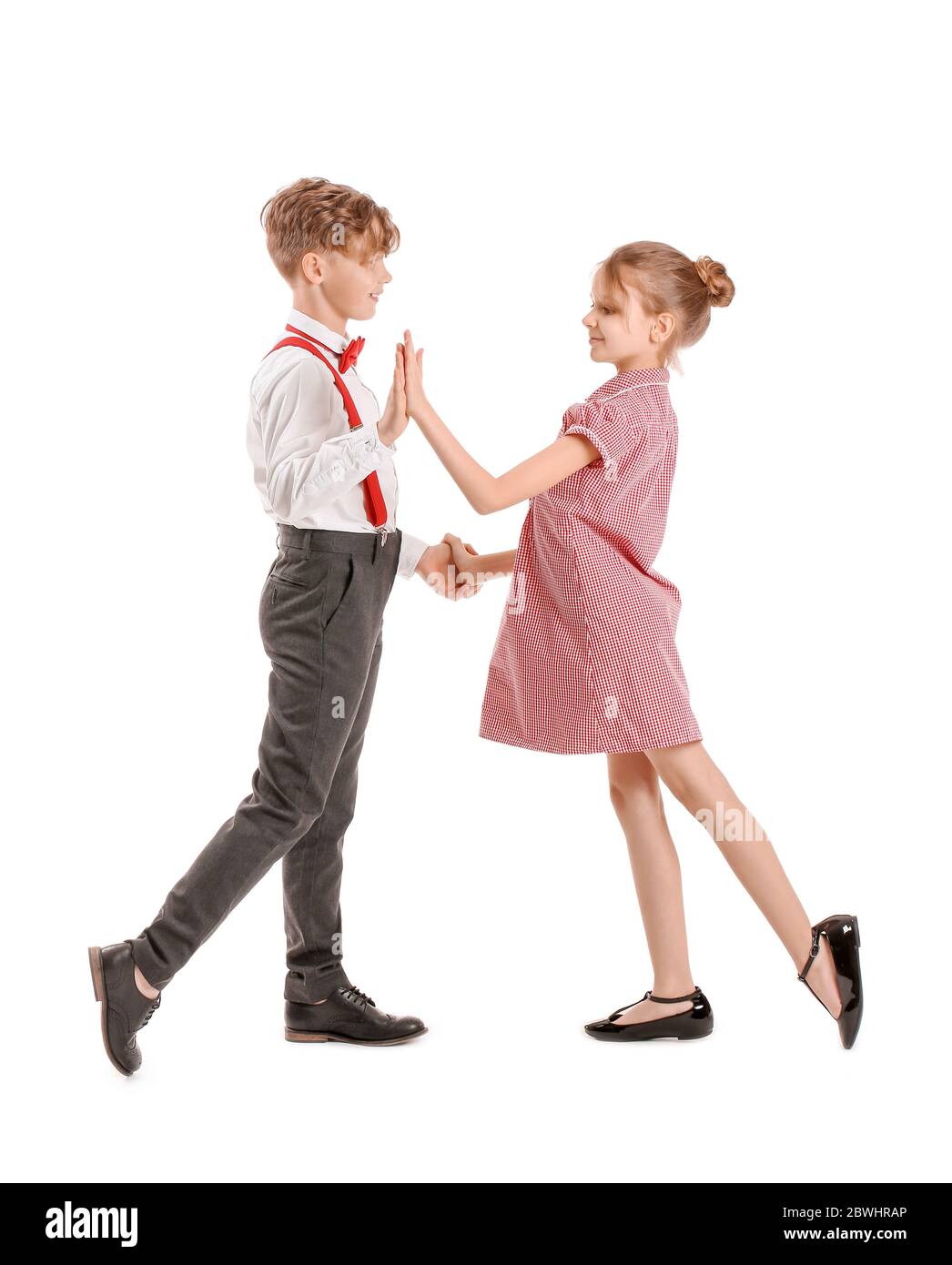 Cute little children dancing against white background Stock Photo - Alamy