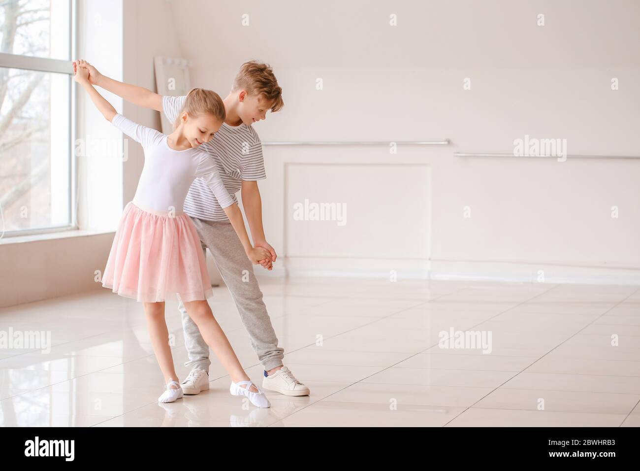 Cute little children dancing in studio Stock Photo - Alamy