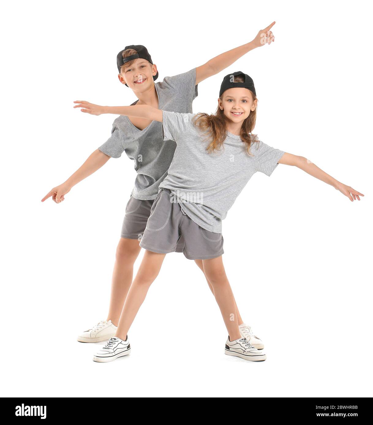 Cute little children dancing against white background Stock Photo - Alamy