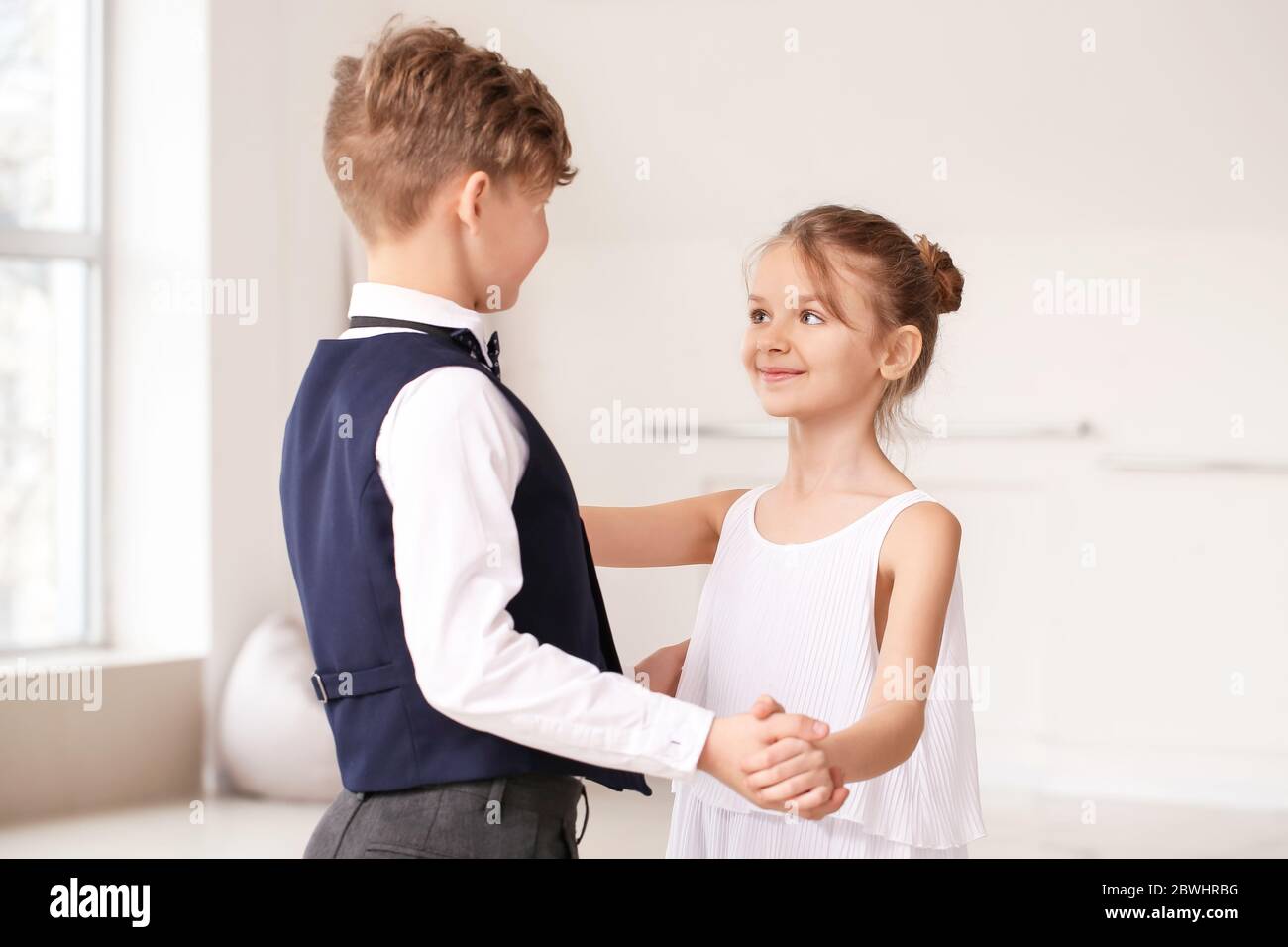 Cute little children dancing in studio Stock Photo - Alamy