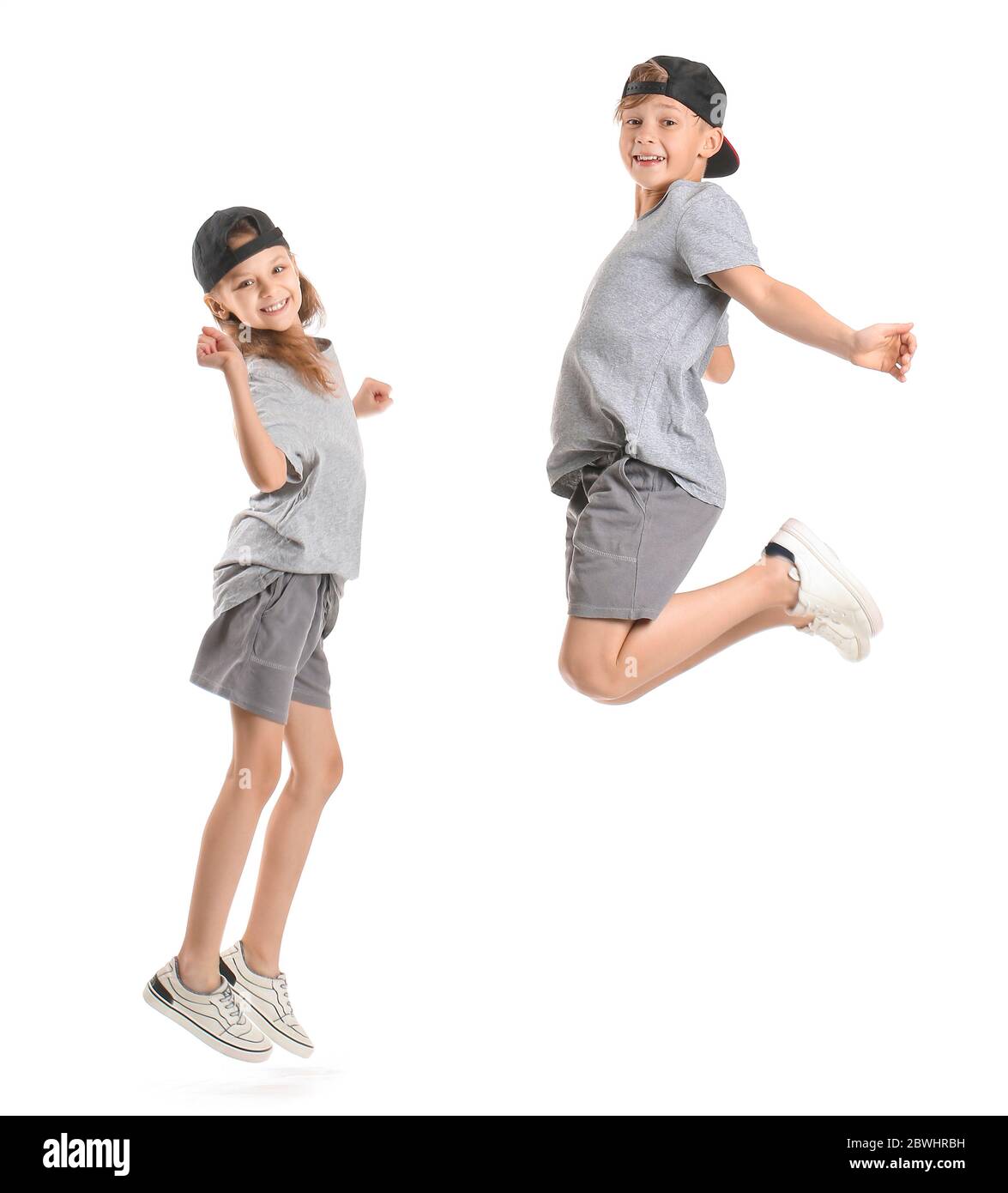 Cute little children dancing against white background Stock Photo - Alamy